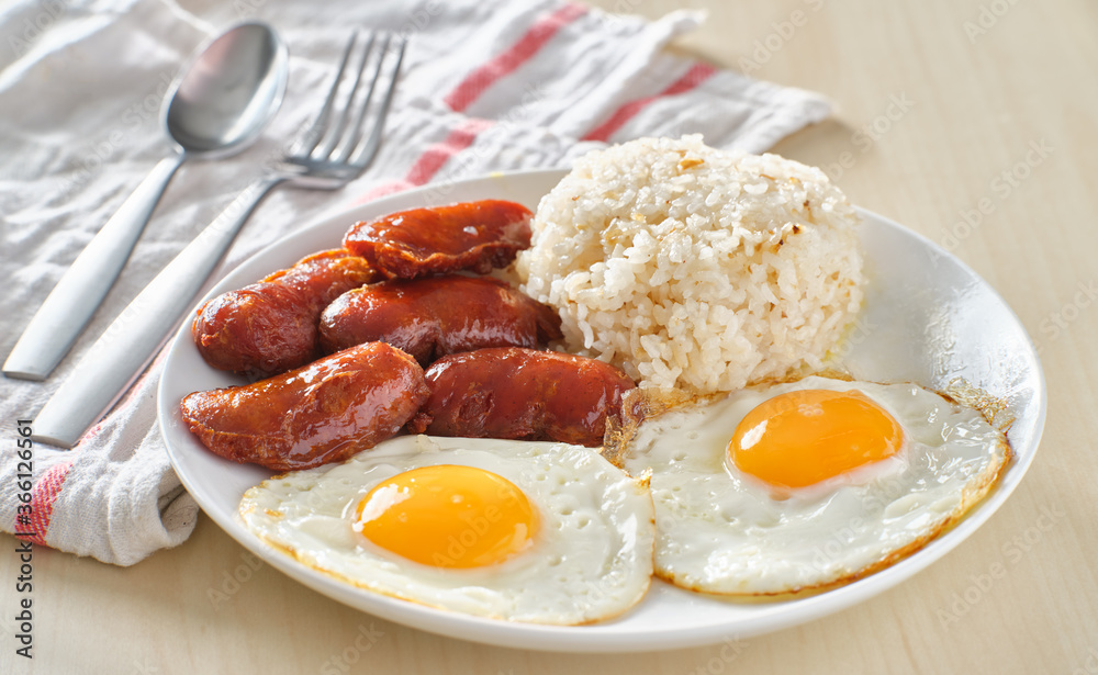 filipino silog breakfast with garlic fried rice, longsilog, and two ...