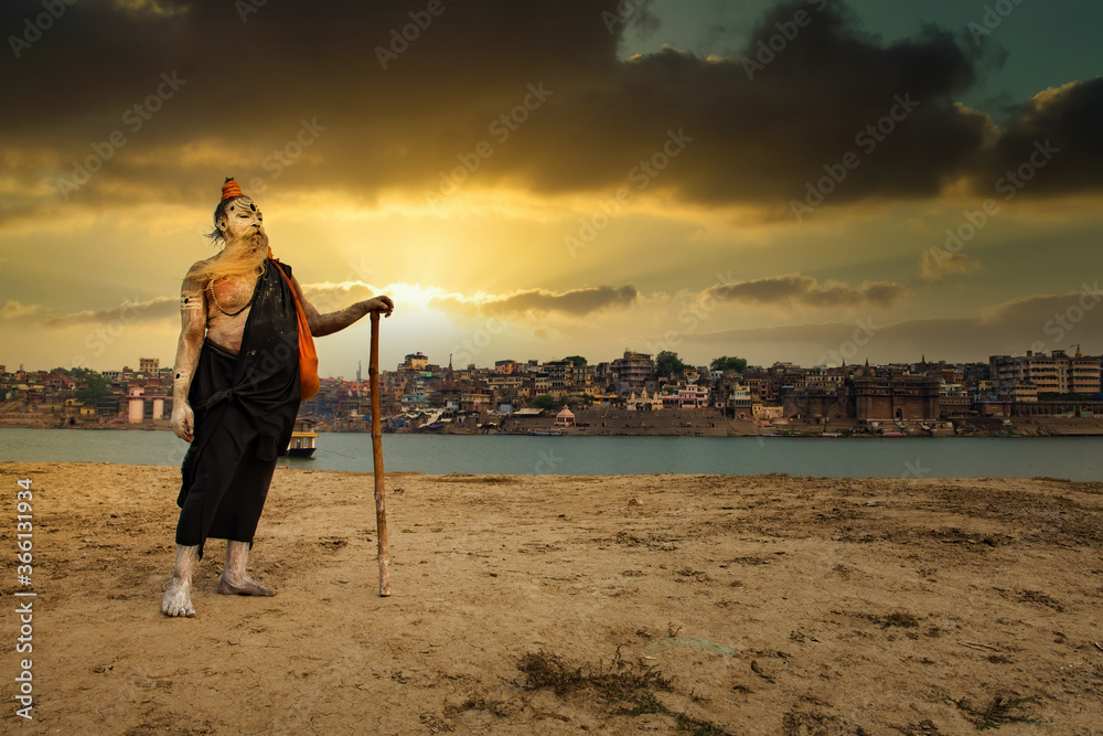 An Indian Hindu Sadhu (saint) on the banks of holy river of Ganges and ...