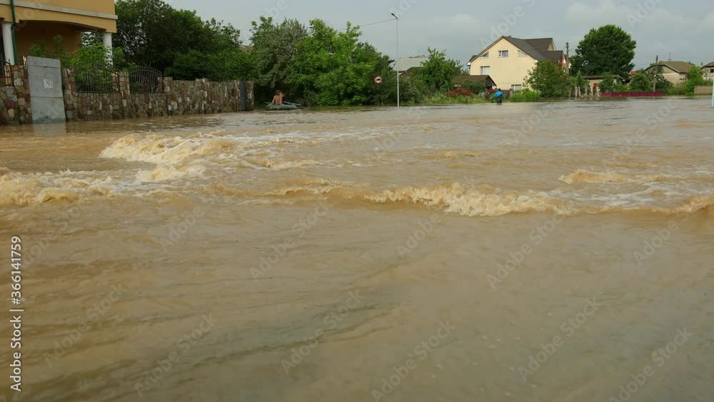 Couple trying to get into flooded home. Evacuated from house in small ...
