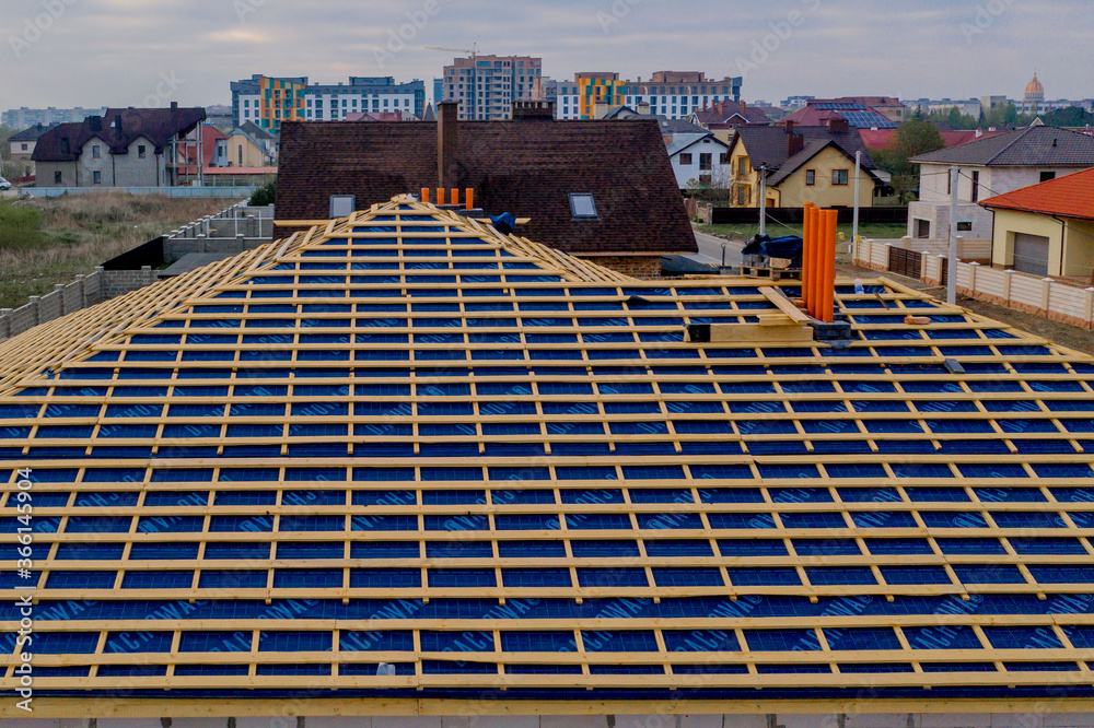 Residential house with wooden roof frame structure under construction ...