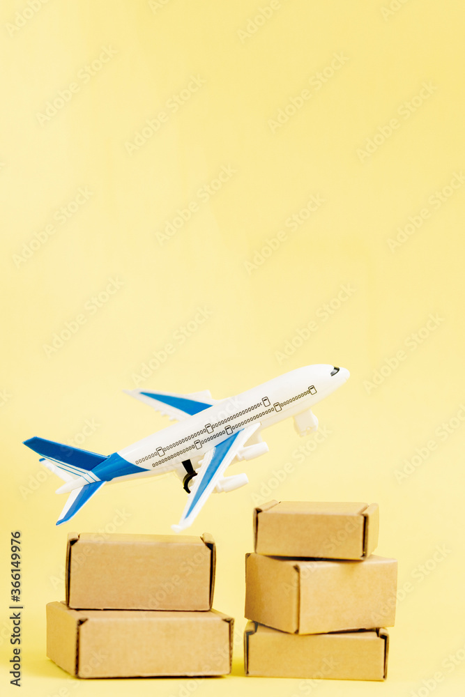 Airplane and stack of cardboard boxes. concept of air cargo and parcels ...