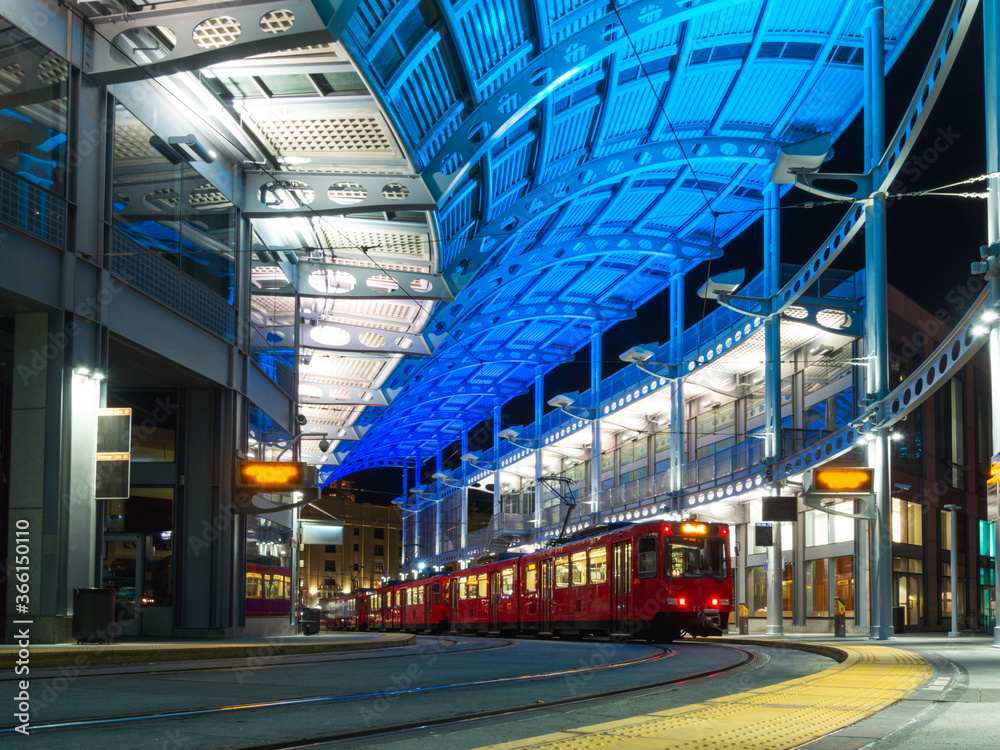 red train at a train station at night with lights Stock Photo | Adobe Stock