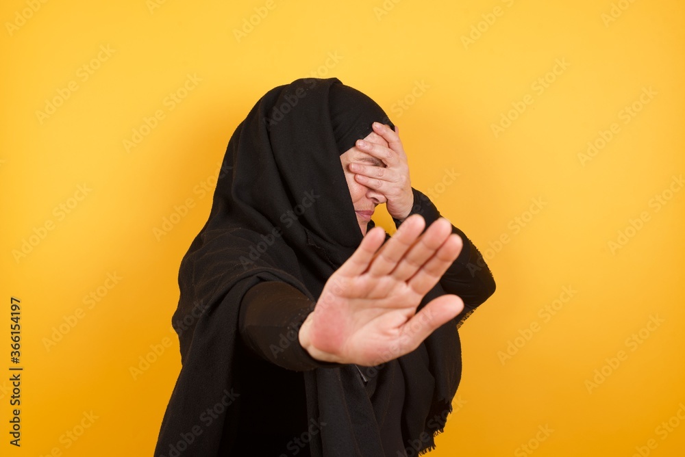 People, body language. Beautiful middle aged muslim woman wearing black ...