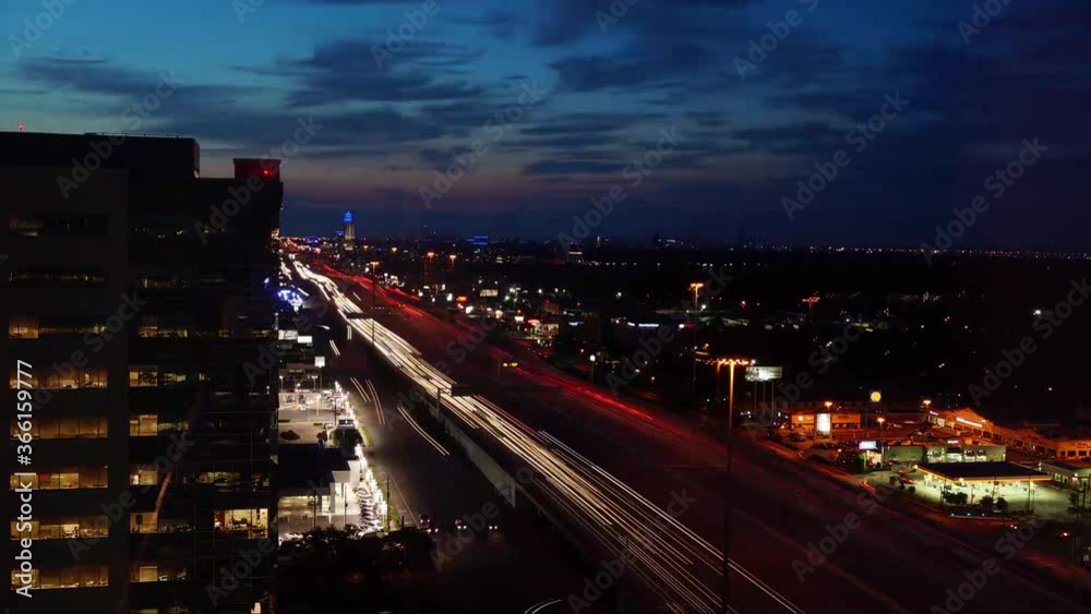 Early morning city traffic timelapse with sunrise as workers commute ...