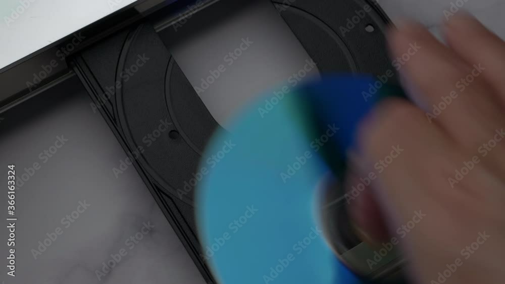 Man Of Hand Remove Disc From The Device DVD/CD Player. Top View DVD ...