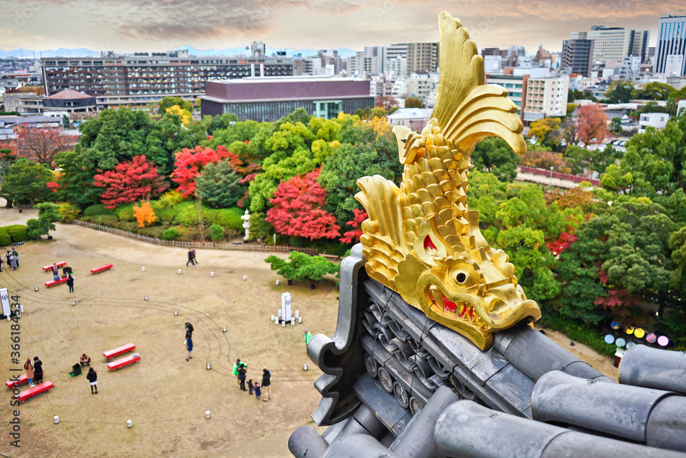 Gold Japanese fish statue on top of Okayama castle in Okayama city ...