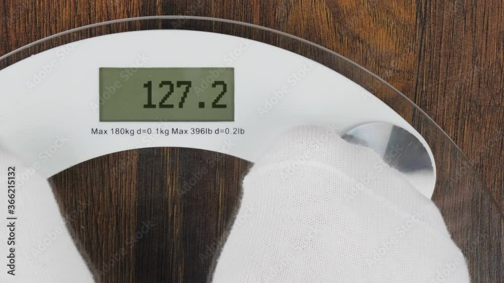 Video Stock Overweight on bathroom scales digital display with an ...