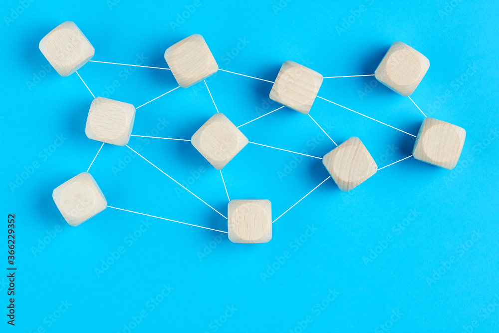 Blank empty wooden blocks linked to each other with lines on blue ...