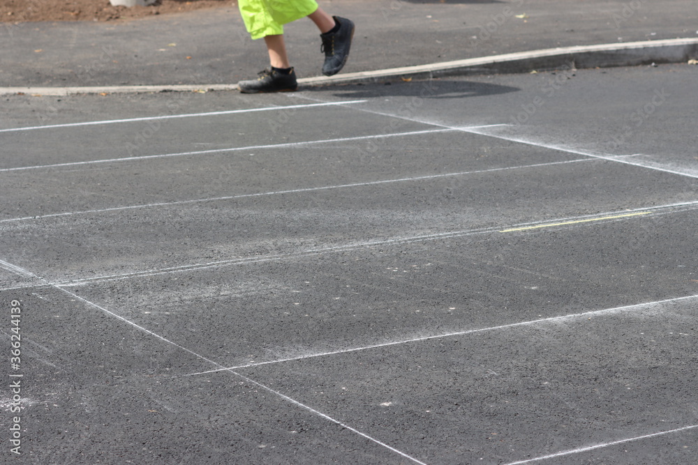 Asphalt road. Thermoplastic road marking. Preliminary marking with ...