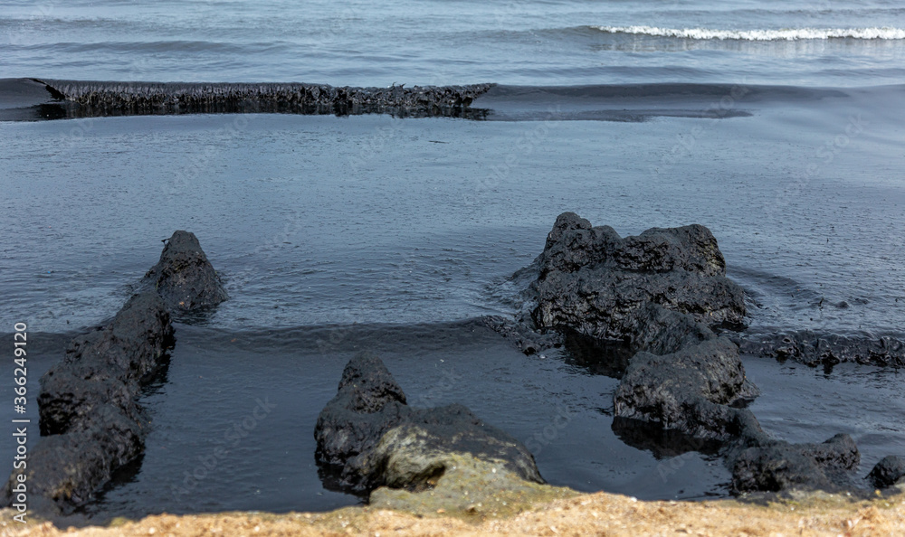 The sea and the beach are polluted with oil. A crude oil spill on the ...