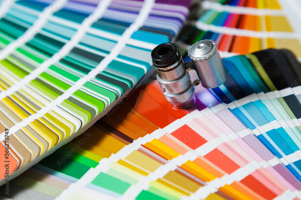 Open color palette swatches with magnifying glass. Close-up Stock Photo ...
