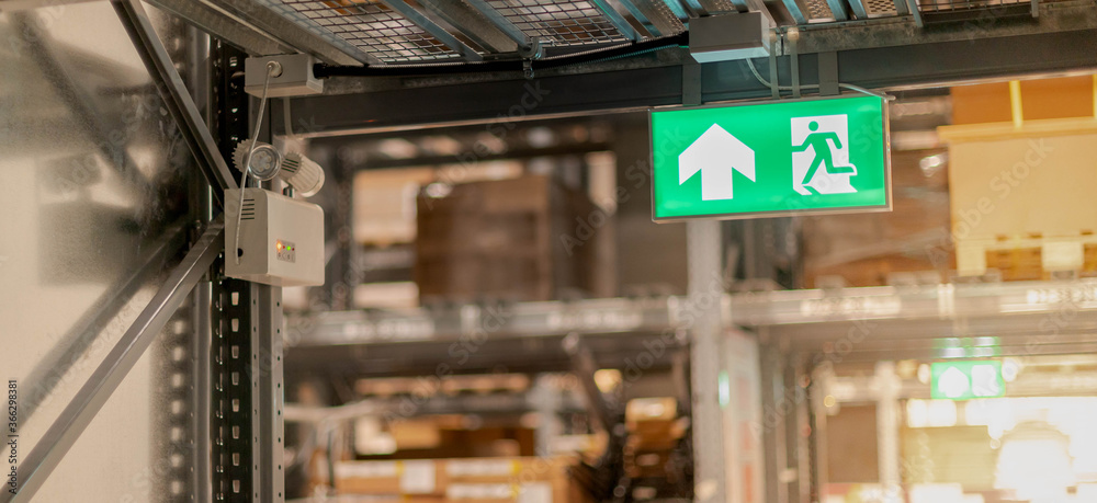 Emergency fire exit sign show the way to escape at the public area ...