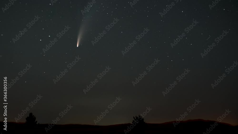 Comet NEOWISE moves across the night sky among the stars. Timelapse ...