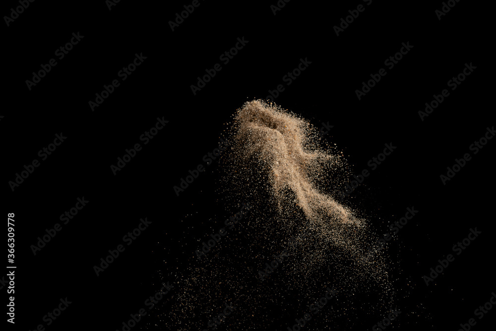 Abstract sand explosion art on black background, sand splash. Stock ...