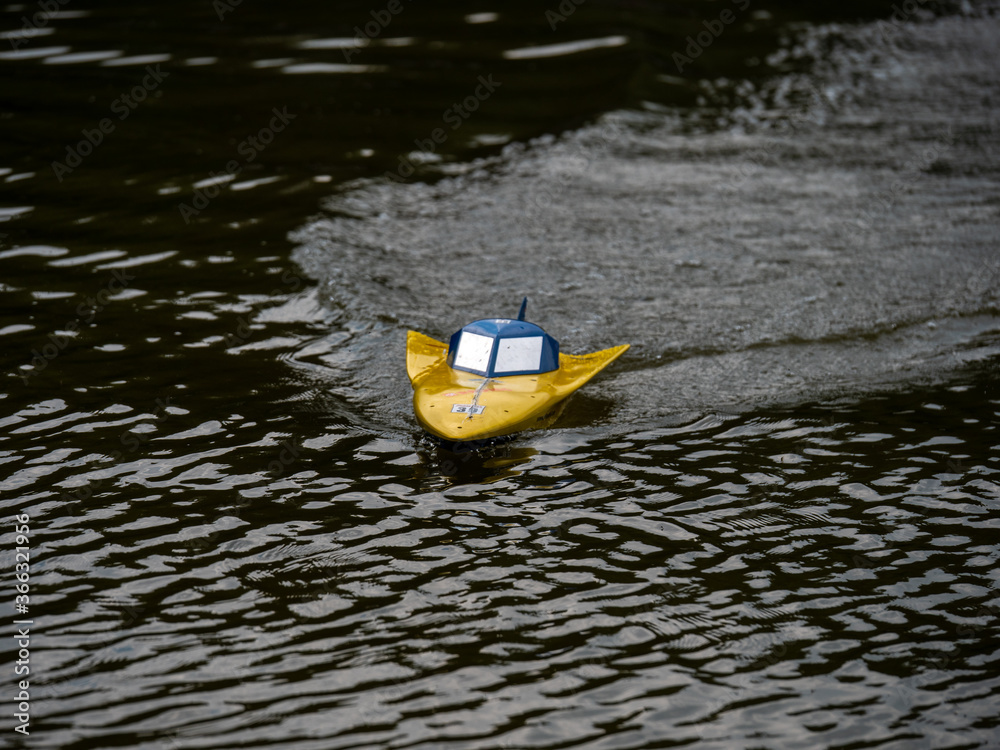 RC controlled jet boat model on lake. Active summer vacation for school ...
