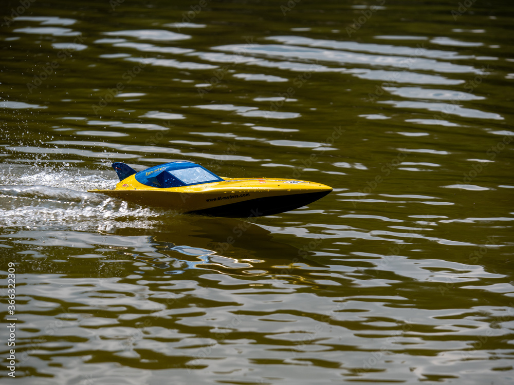 RC controlled jet boat model on lake. Active summer vacation for school ...