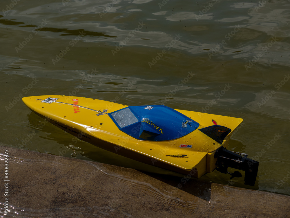 RC controlled jet boat model on lake. Active summer vacation for school ...