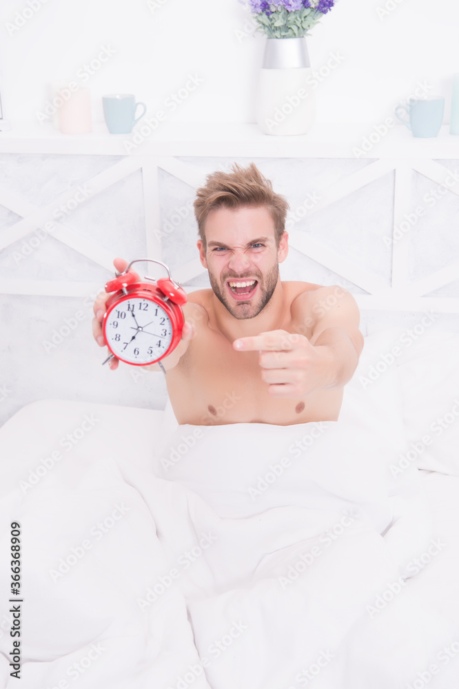 Look at this clock. Stressful man point finger at clock face. Sexy guy ...