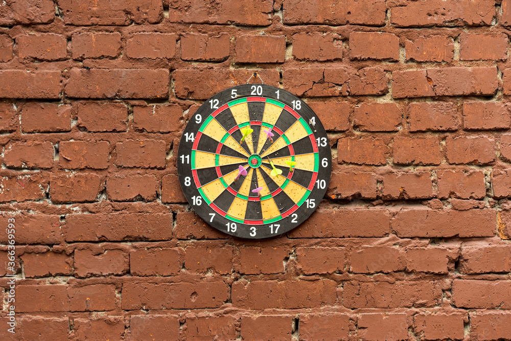 Darts Stuck On Dartboard Mounted On Brick Wall. Darts Hit Target ...
