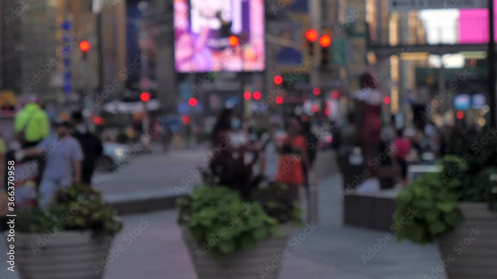 blurry cityscape of unrecognized people sightseeing at midtown, times ...