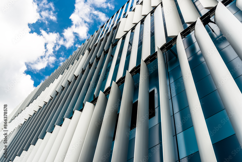 The facade of a modern building with an innovative facade made of ...