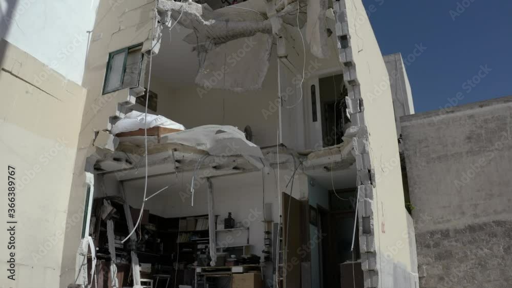 Destroyed building, collapse, Malta, Drone smooth flying through closed ...