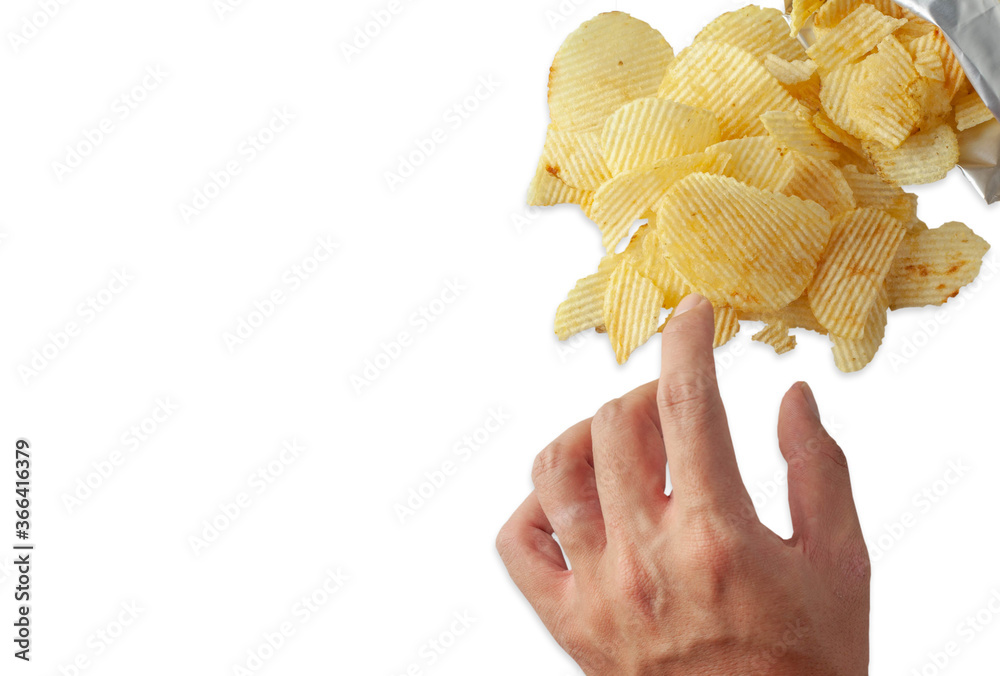 tasty corrugated chips in hand isolated on white background, potato ...