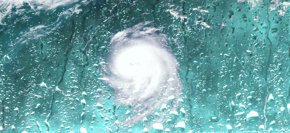 Cyclone behind wet rainy window. The eye of the hurricane. Typhoons and ...