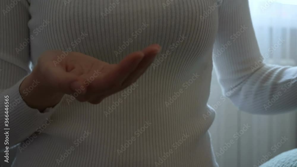 Women's hands apply an antiseptic, disinfectant, alcohol or ...