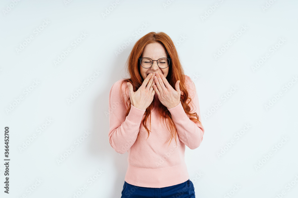 Embarrassed young woman giggling to herself Stock Photo | Adobe Stock