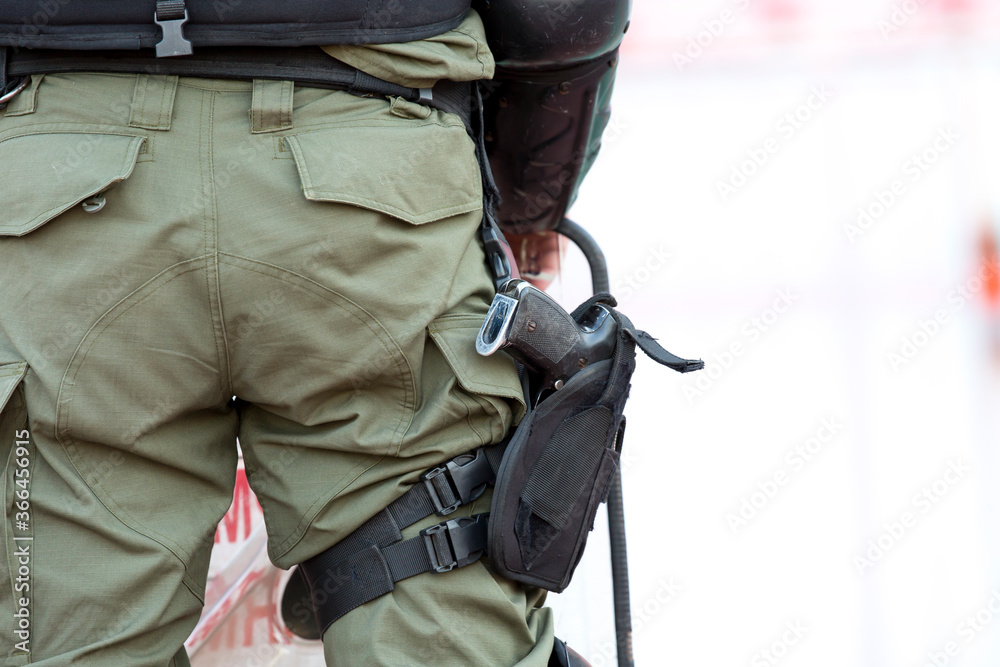 Police with a gun on their belts Stock Photo | Adobe Stock