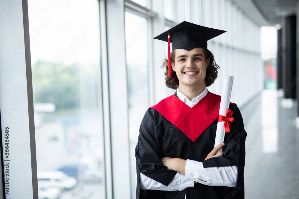Graduate male student - graduation concepts. Portrait on his graduation ...