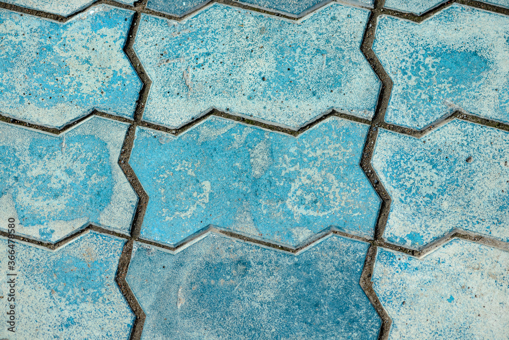 Streetlights and texture of different colored patterned paving slabs on ...