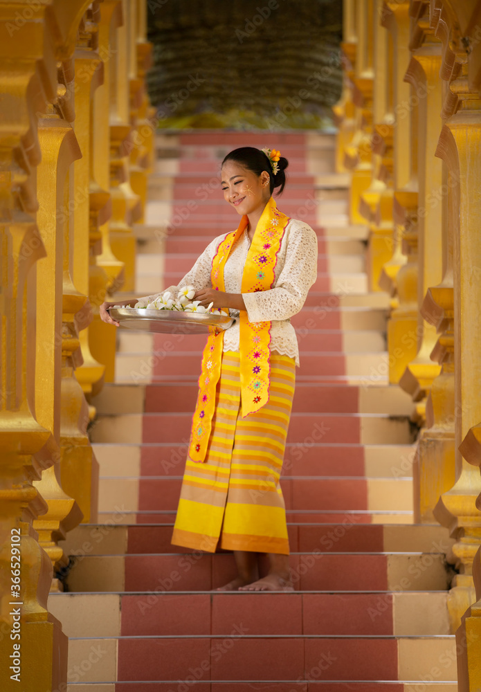 Women Burmese Buddhist faithful are walking barefoot around the ...