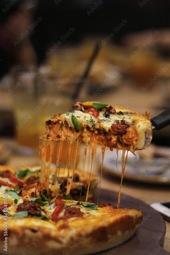 Pizza Cheese Pull. Hand pulling cheese pizza in a restaurant. Cheese ...