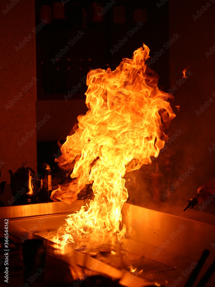 Japanese Teppanyaki Fire. Flame on Teppanyaki Grill. Japanese Chef is ...