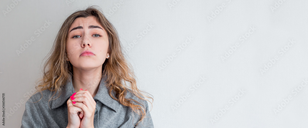 Closeup portrait of sad, hopeful young woman, mother praying, hoping ...
