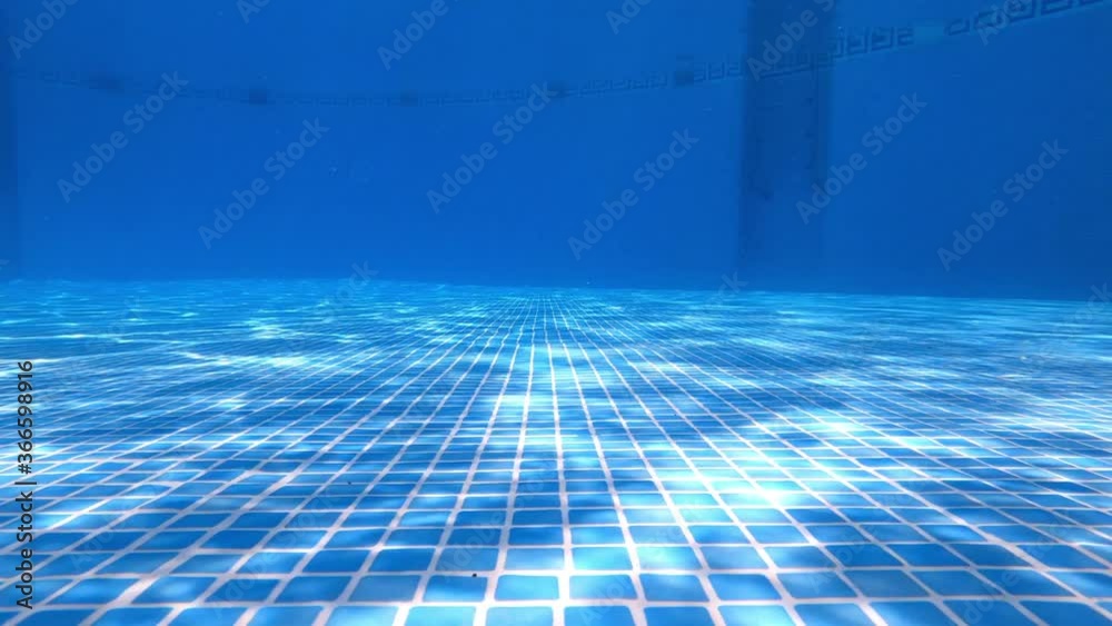 Tiles floor inside a pool underwater view of blue tile pool Stock ビデオ ...