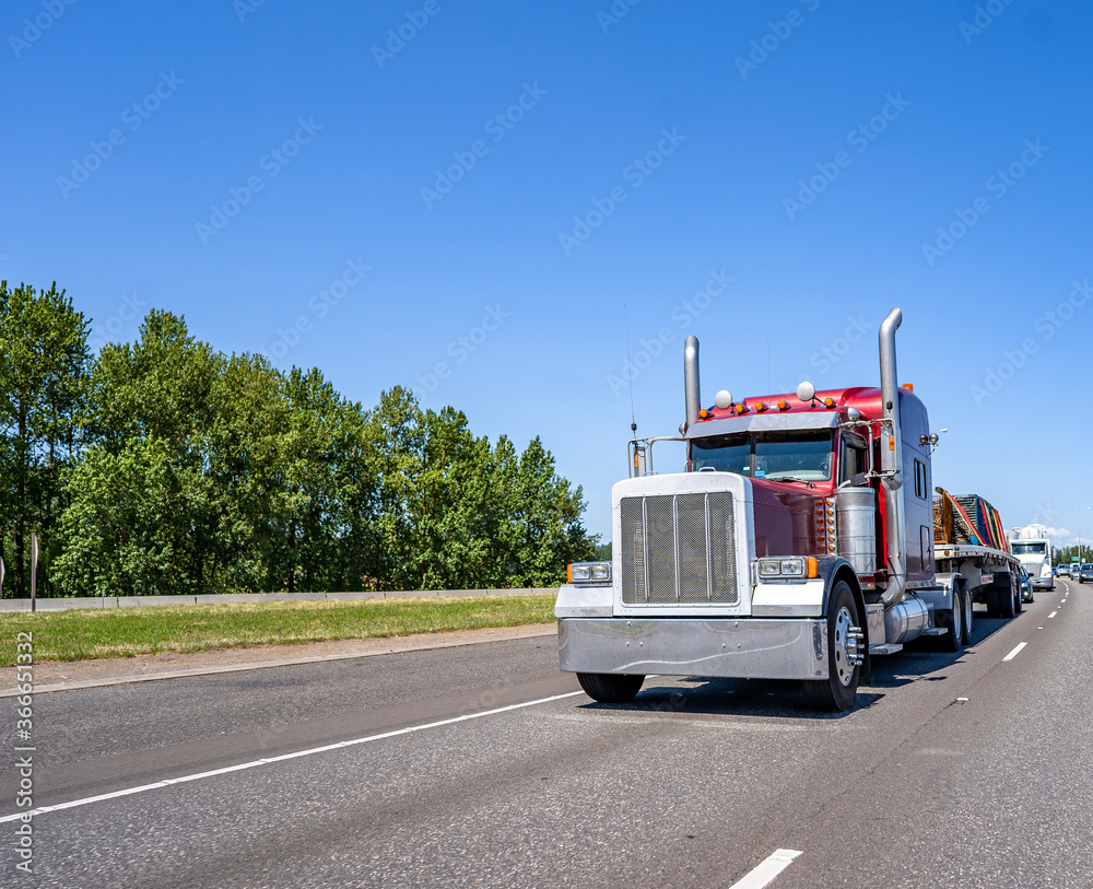 Red big rig classic semi truck tractor with chrome accessories and ...