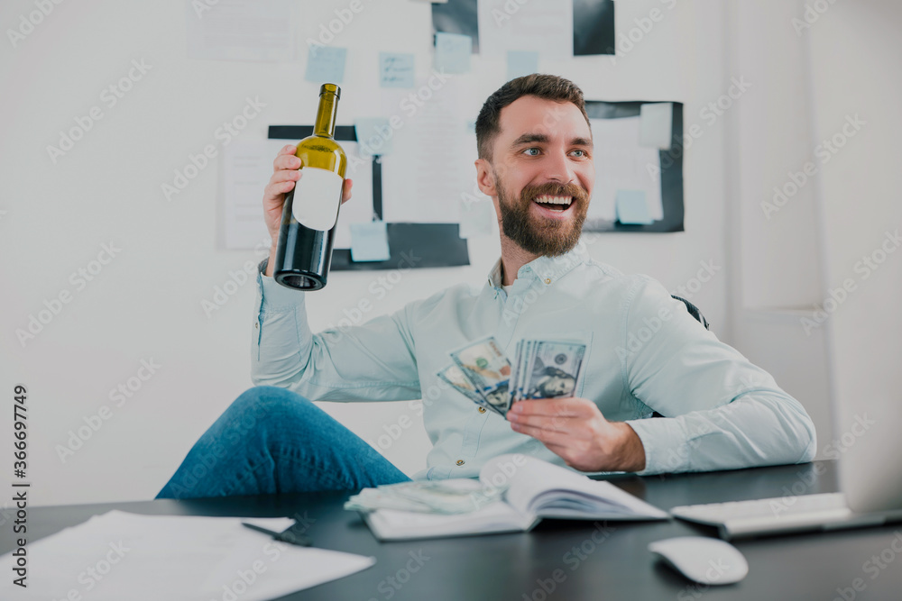 bearded man drinking wine celebrating successful business deal in ...