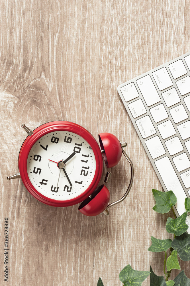 Computer and alarm clock. Work hours, working hours, telework, business ...