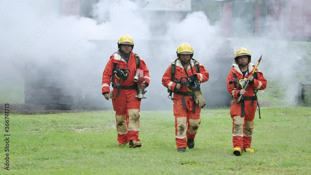 Fireman or firefighter teamwork from fire department wearing fire ...