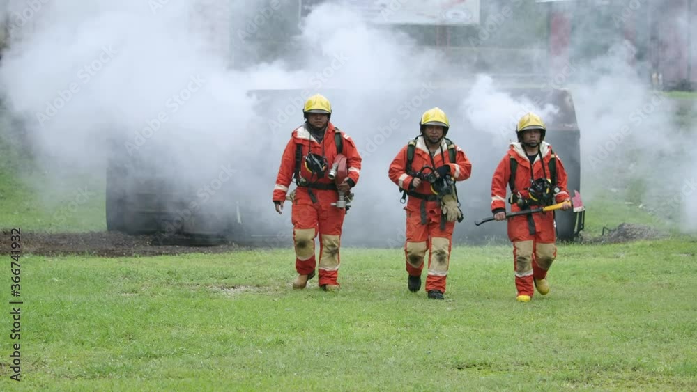 Fireman or firefighter teamwork from fire department wearing fire ...