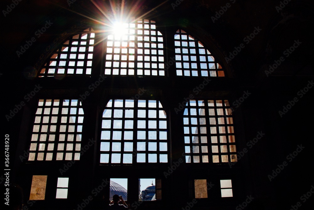 Big arched window with the glaring sun shining through at the Hagia ...
