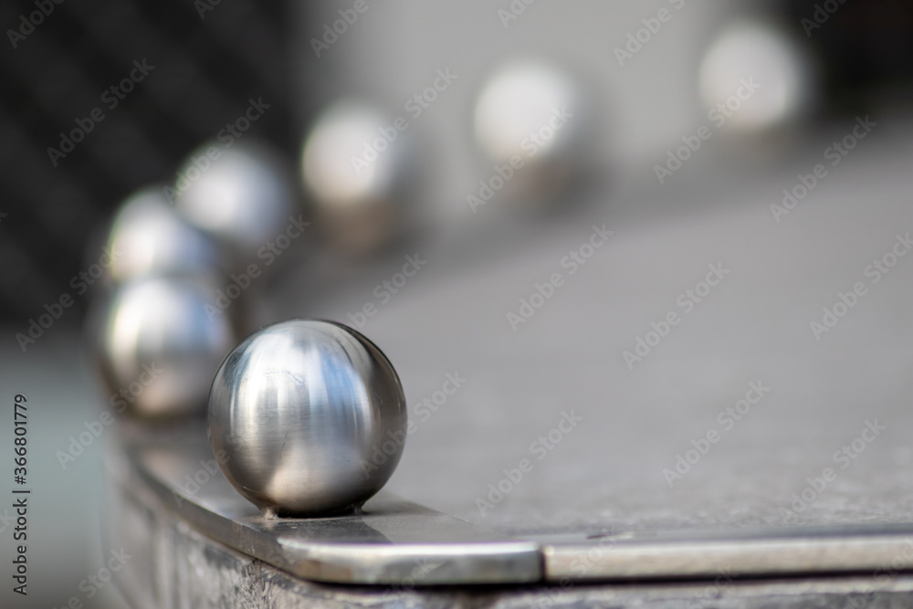 Matt steel balls in a row as decorative and ornamental balustrade and ...
