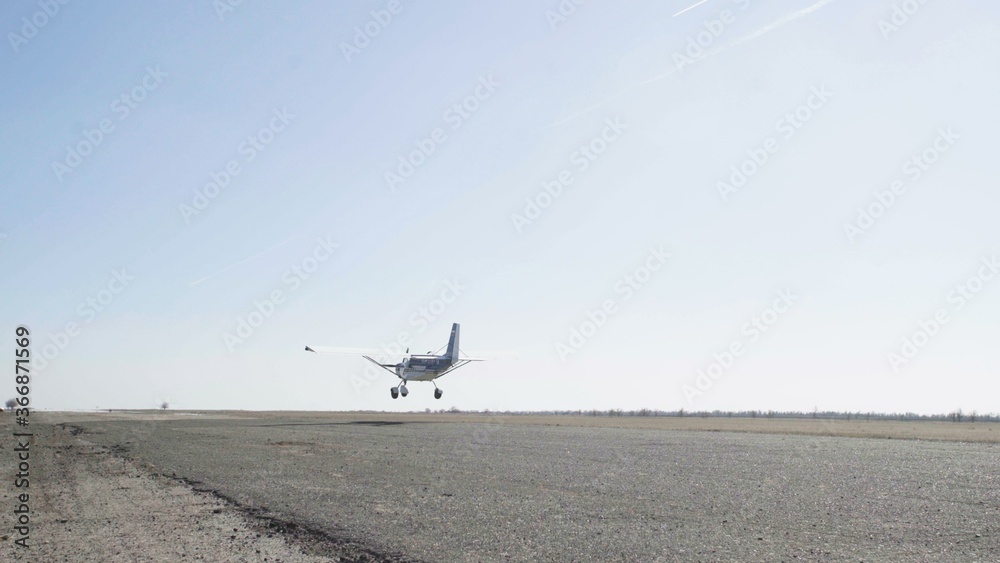 Plane taking off leaving the ground. Small plane takes off from the ...
