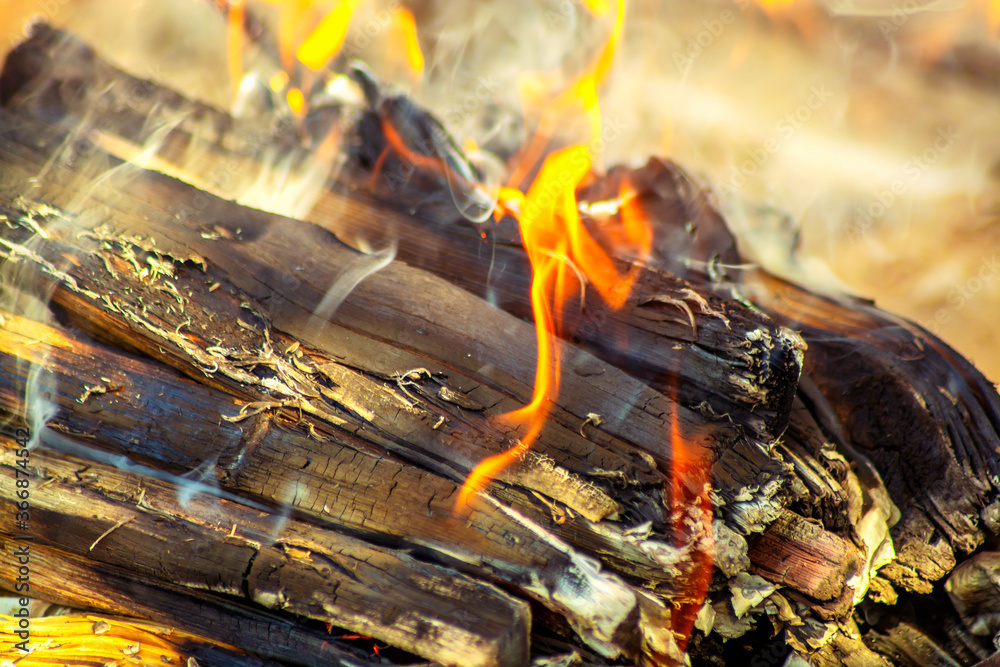 Vivid smoldered firewoods burned in fire close up. Atmospheric ...