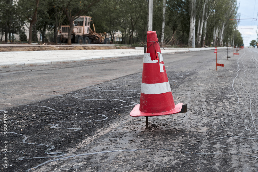 road construction or repair - laying a new layer of asphalt, marking ...