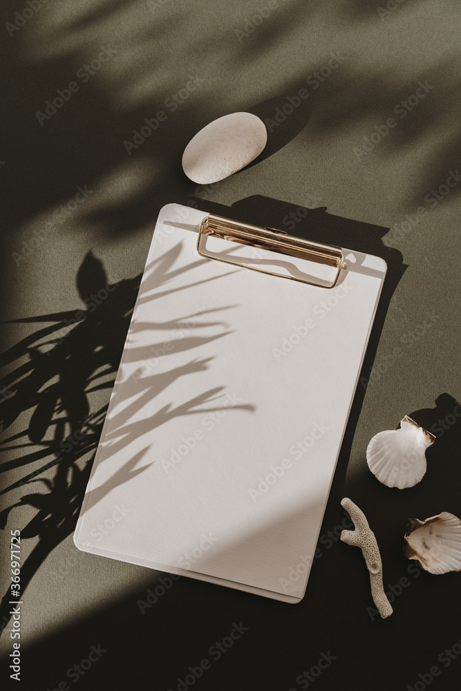 Blank paper sheet clipboard pad with mockup copy space, stones ...