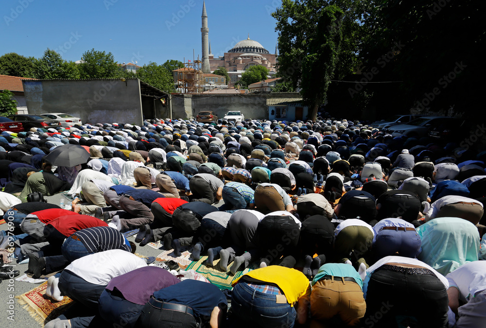 Muslims pray in front of Hagia Sophia during the first friday-prayer ...